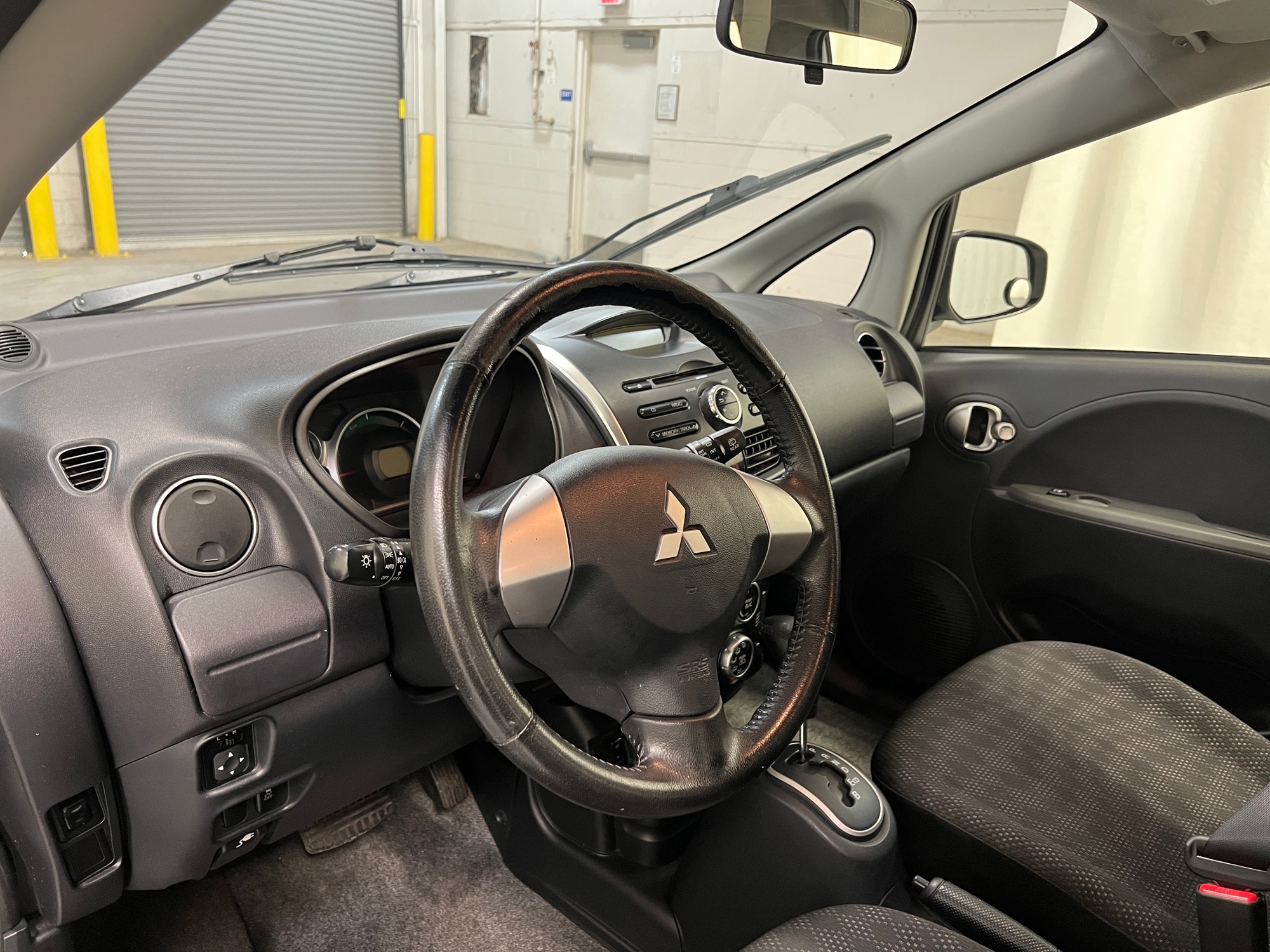 Any cars with a cup holder to the left of the steering wheel? : r/Autos